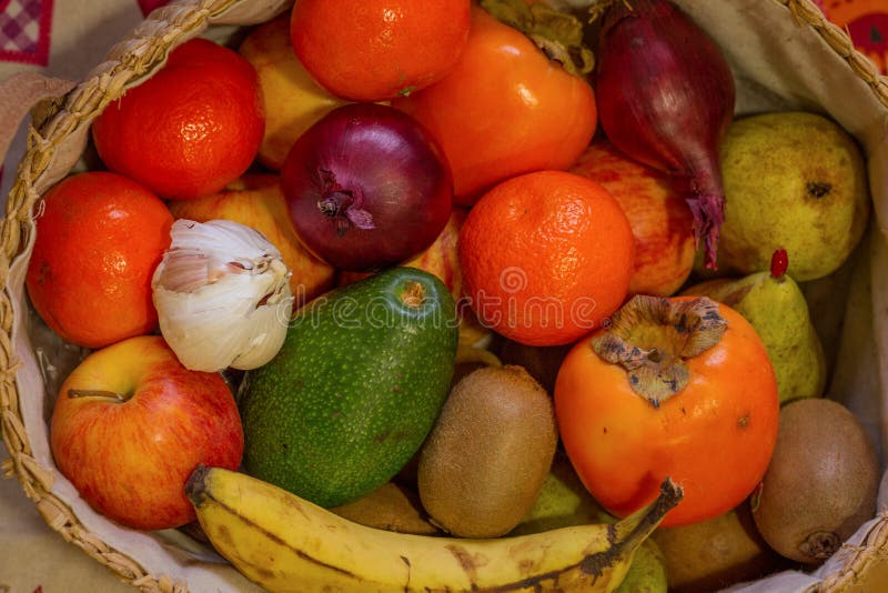 Close Up View of Basquet Full of Fruits and a Head of Garlic. Stock ...