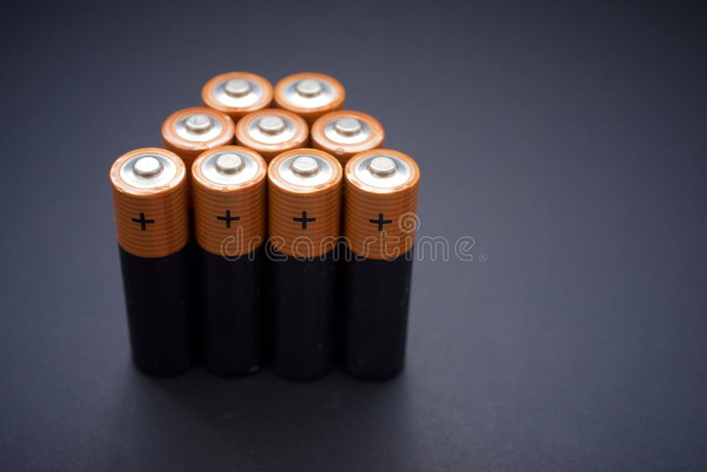 Close-up of Batteries on a Black Table Stock Photo - Image of ...