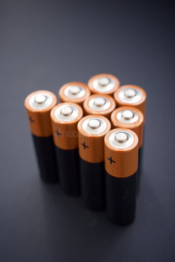 Close-up of Batteries on a Black Table Stock Photo - Image of group ...