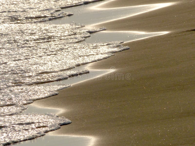Close Up Beach with Sunset Reflected on Surface Stock Photo - Image of ...