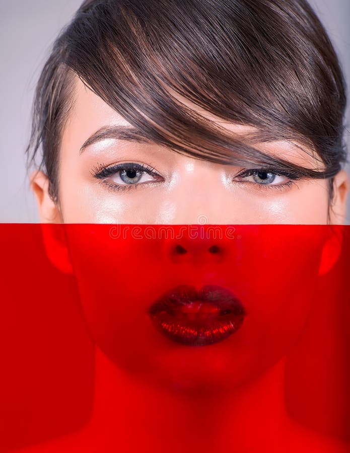 Close Up Of A Beautiful Caucasian Woman With Cat Blue Eyes Full Lips