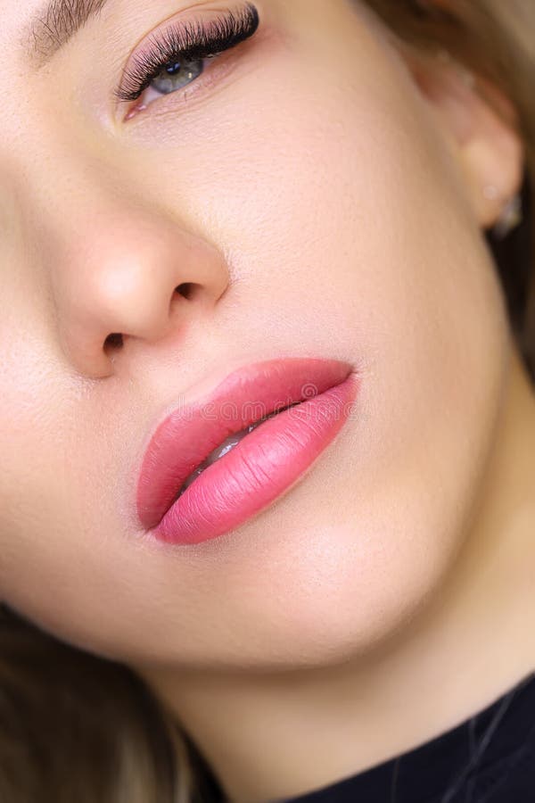 The Beautiful Lips of a Young Model with a Lip Tattoo Stock Photo ...