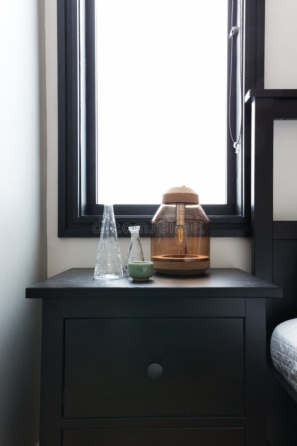 Close Up of Bedside Table with Ornaments and Bright Window Behind Stock ...