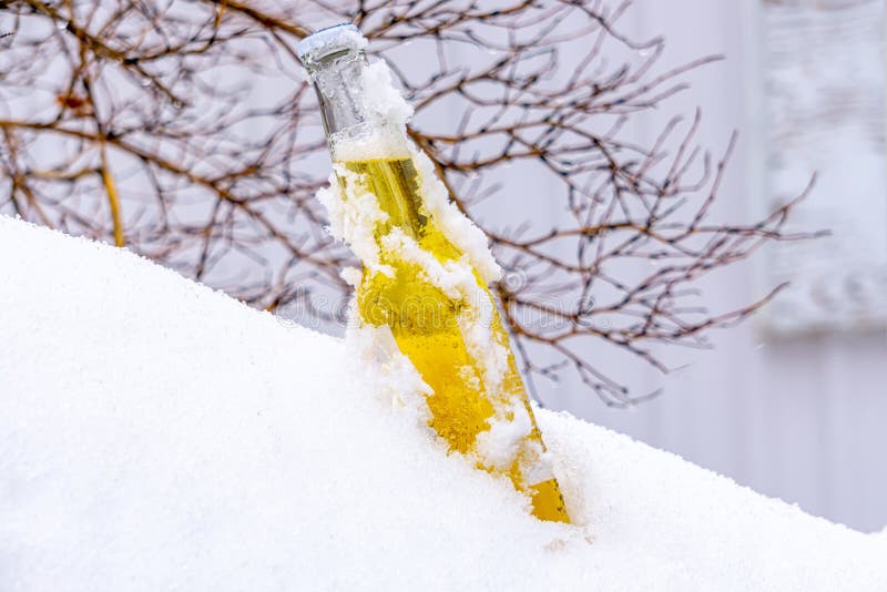 Close Up of Beer Bottle in the Snow Stock Image - Image of closeup ...