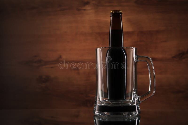 Close Up of Beer Bottles in Glass Cup Stock Photo - Image of dark, foam ...