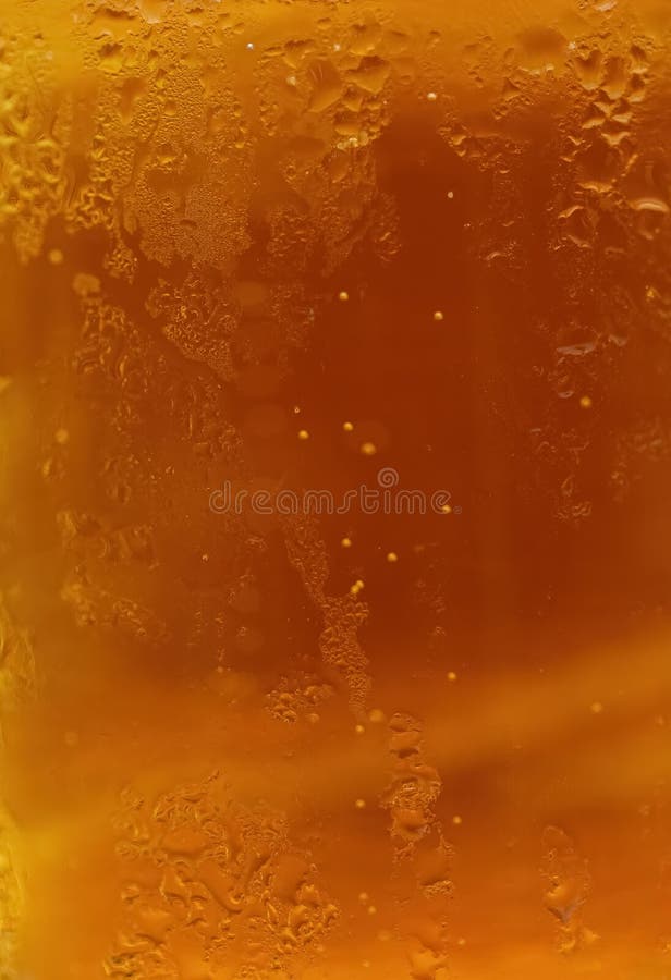 Close-up of a Beer Mug. Orange Texture with Bubbles Stock Photo - Image ...