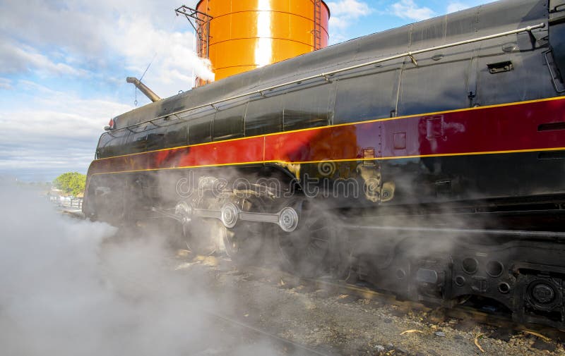 Close Up of a Big Restored Steam Engine Passing by Blowing Lots of ...