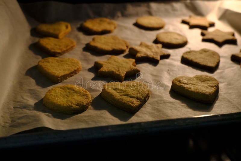 Close Up Biscuits Pastry of Different Shapes on Baking Paper in Oven ...