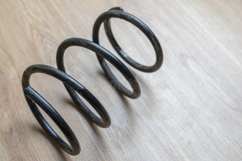 A Close Up Black Car Suspension Spring Isolated Stock Photo - Image of ...