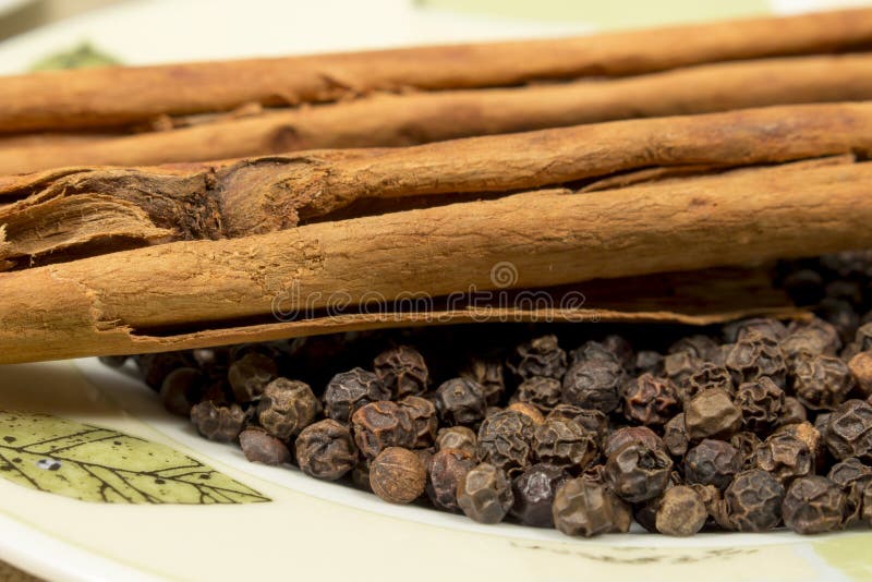 Close-up of Black Pepper Grains and Cinnamon Sticks Stock Image - Image ...