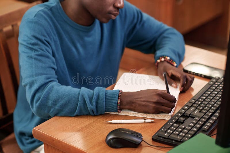 Close Up of Black Student Writing in Notebook Stock Image - Image of ...
