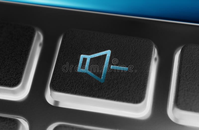 Close Up of a Black Volume Down Button of a Black Remote Control with ...