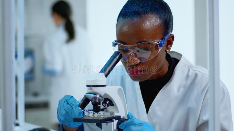 Close Up of Black Woman Looking in Microscope Stock Image - Image of ...