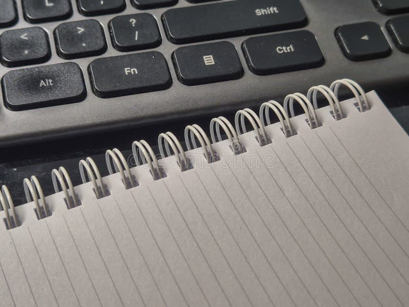 A Close-up of a Blank Notebook Lying Next To a Computer Keyboard, Ideal ...