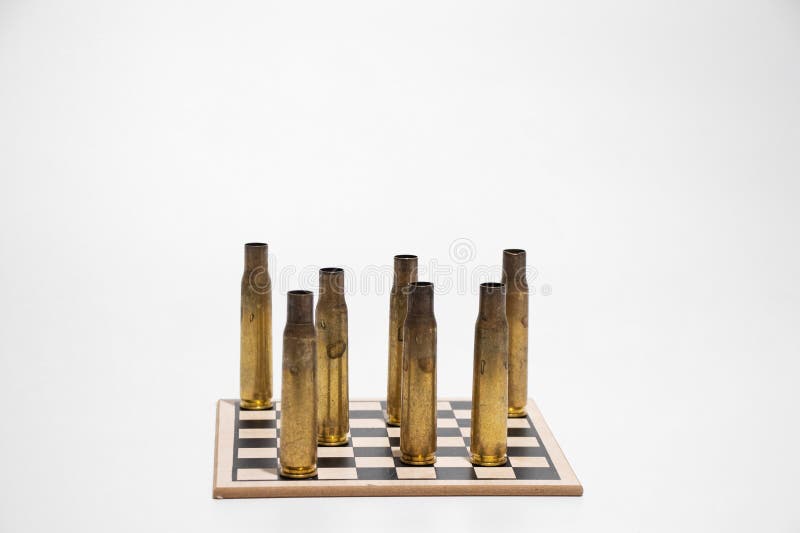 Close-up of a Blank Rifle Casing on a Chessboard on a White Background ...