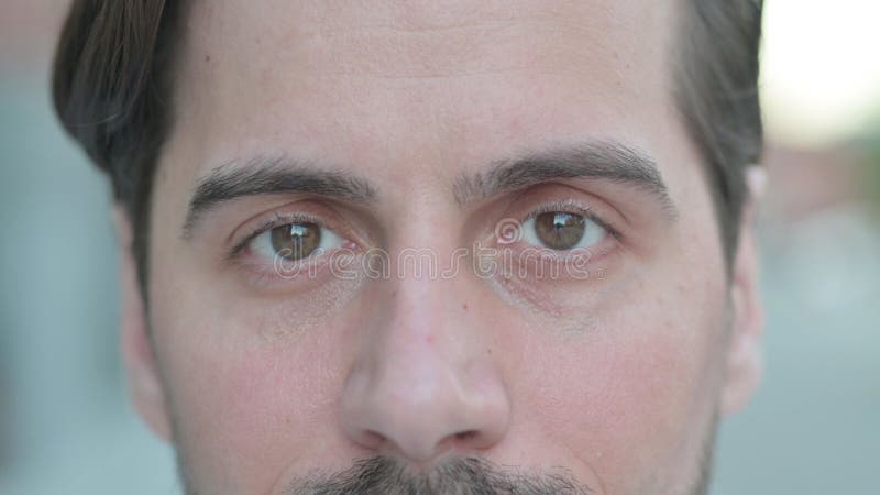 Close Up of Blinking Eyes of Man Looking at Camera Stock Photo - Image ...