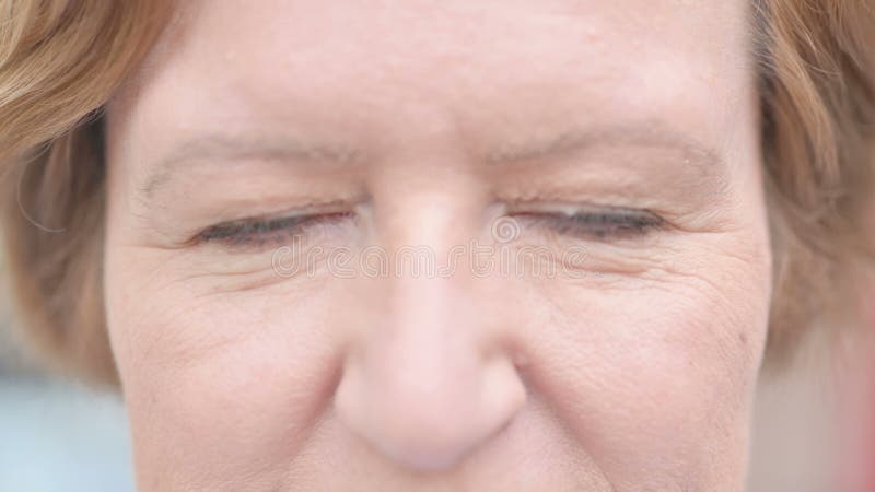 Close Up of Blinking Eyes of Old Woman Stock Video - Video of outdoor ...