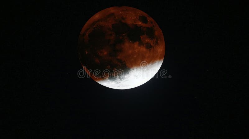 A Close-up of a Blood Moon in the Night Sky. Half of the Moon is ...