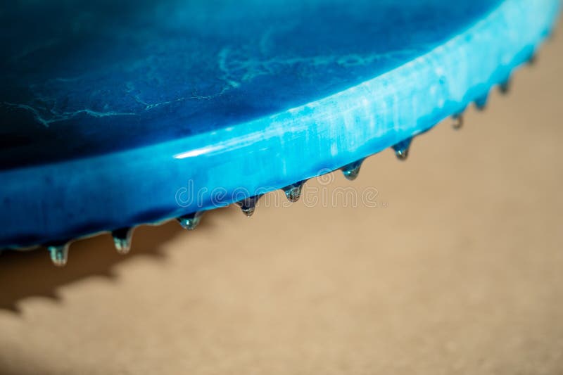 Close Up of Blue Epoxy Resin Drying on Canvas, Droplets Flowing from ...
