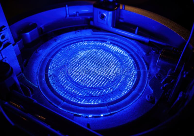 Close-up of a Blue Illuminated Circular Device with Intricate Patterns ...