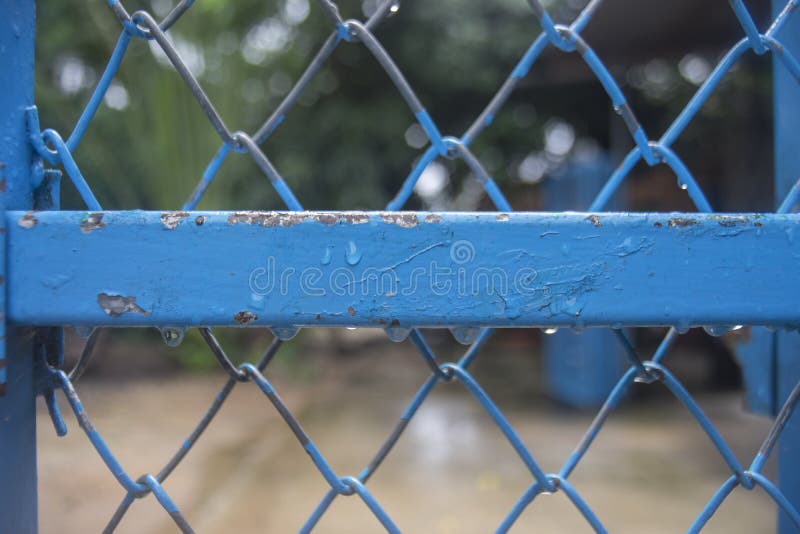 Close Up Blue Iron Bar and Wire of Fence with Water Drop of Rain Stock ...