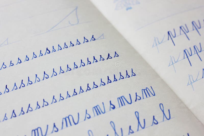 Close-up of Blue Letters Written in Cursive by a Child in a Paper ...