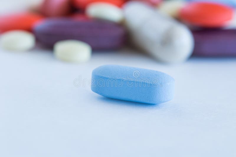 Close Up of Blue Medicine Pill. Stock Image - Image of assorted, orange ...