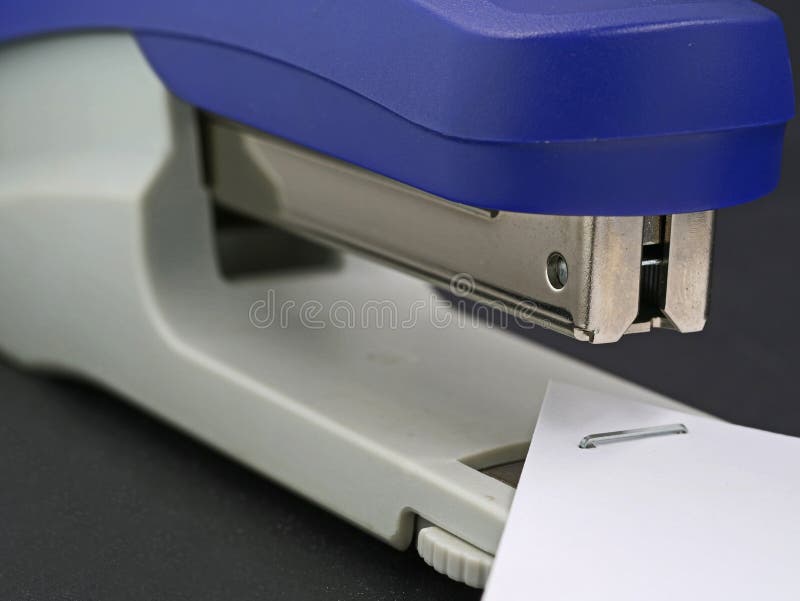 Close Up of Blue Stapler with Stapled Paper Stock Photo - Image of ...