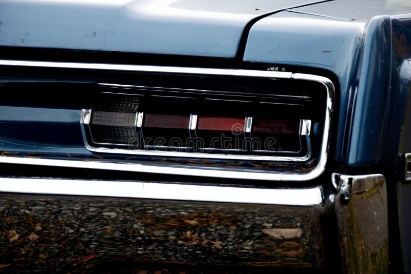 A Vintage Car Tail Light Illuminates a Cobbled Street, Embodying ...