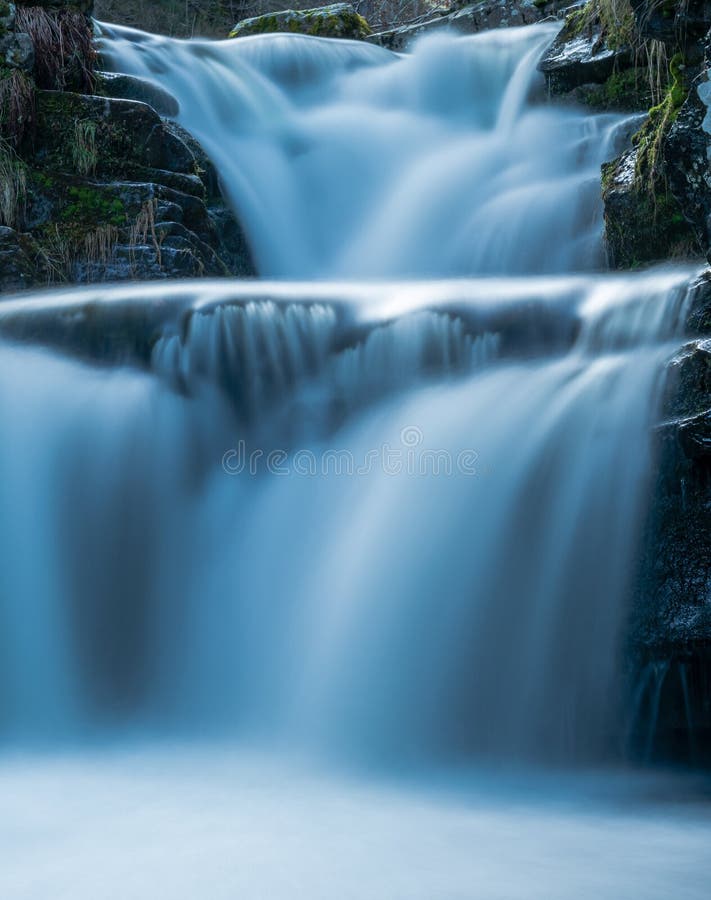 Scene with Blue Waterfall among the Mountains Stock Photo - Image of ...