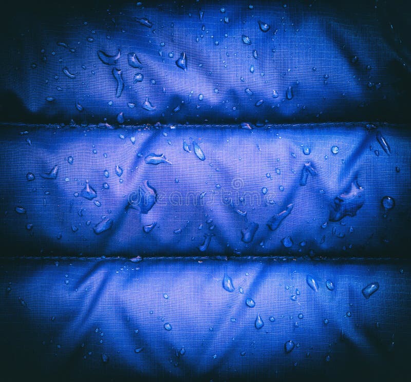 A Close Up of Blue Waterproof Rain Jacket Fabric with Water Droplets ...