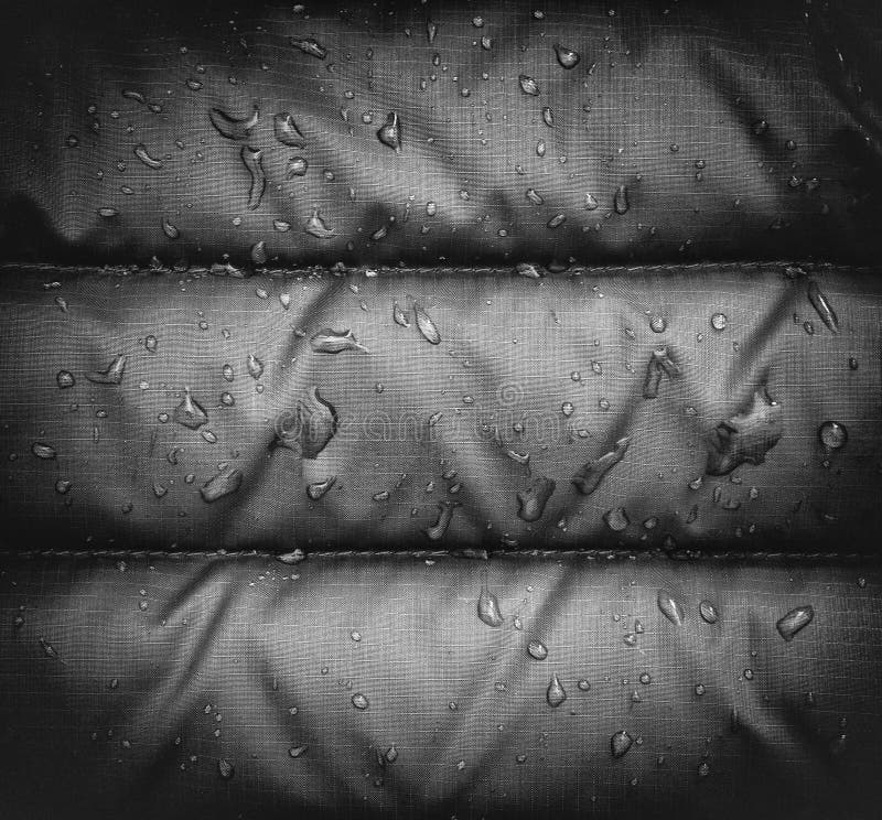 A Close Up of Blue Waterproof Rain Jacket Fabric with Water Droplets ...