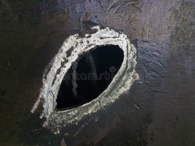 Close-up,Blur Shallow Depth of Field. a Hole with Torn Edges in a Dark ...