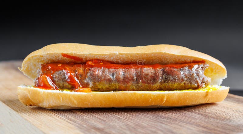 Boerewors Roll (rolled Sausage) with Onions and Relish on a Blue Picnic ...