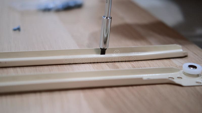 Close-up of Bolt Being Screwed in with Screwdriver. Process of ...