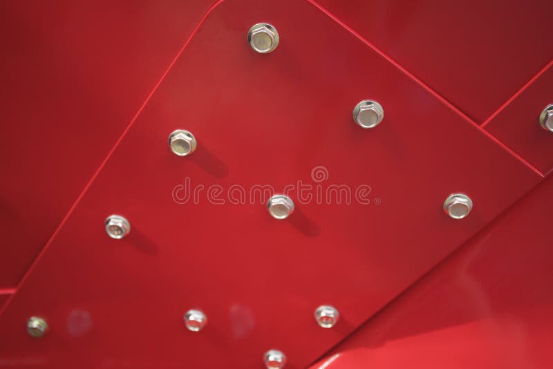 Close Up of Bolts and Nuts on Iron Wall Painted in Red Stock Photo ...