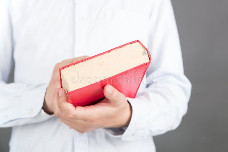 Close-up of book in hand stock photo. Image of carrier - 253701390