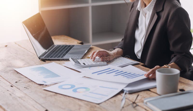 Close Up Bookkeepers Working with Balance Sheet To Analyze Problems and Find Solutions To ...