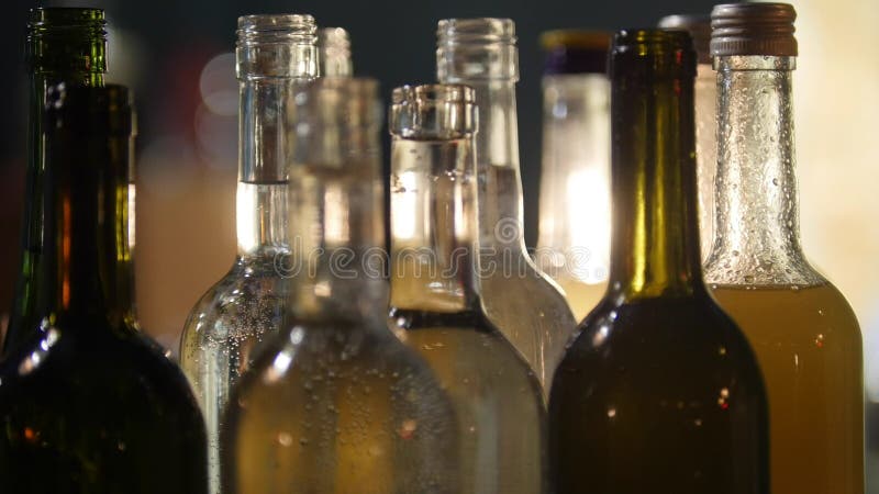 Close-up of Bottles Full of Different Alcohol at the Bar with Soft ...