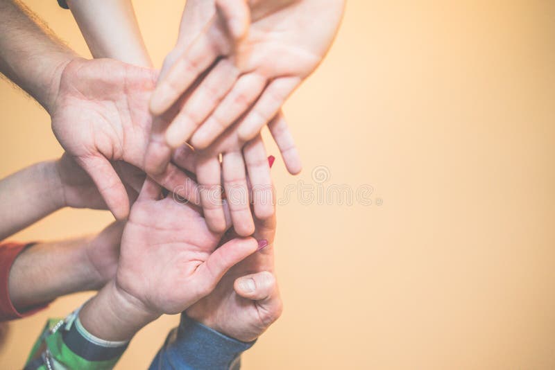 Close Up Bottom View of Young People Putting Their Hands Together ...
