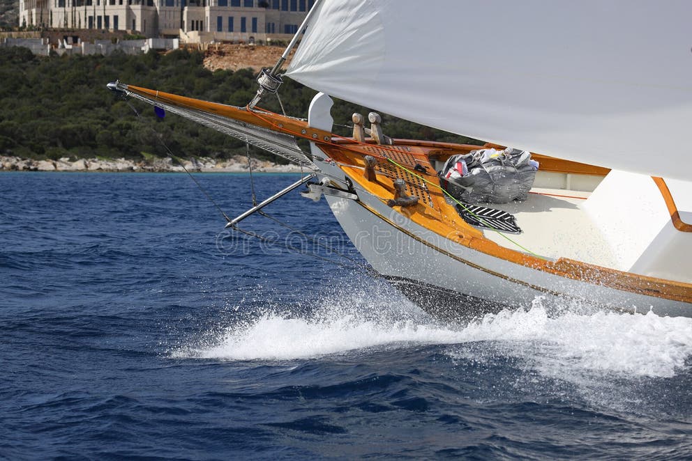 Close Up on the Bow of a Sailboat Breaking through a Wave Stock Image ...