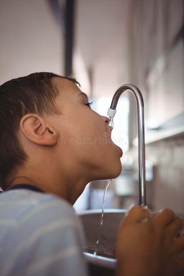Close Up of Boy Drinking Water from Faucet Stock Image - Image of ...