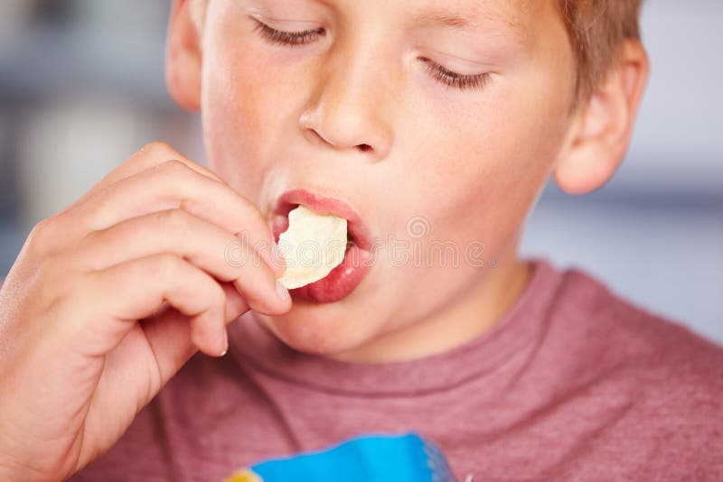 Close Up of Boy Eating Packet of Potato Chips Stock Image - Image of ...
