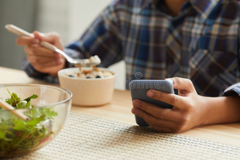 Boy Using Phone during Meal Stock Photo - Image of technology ...