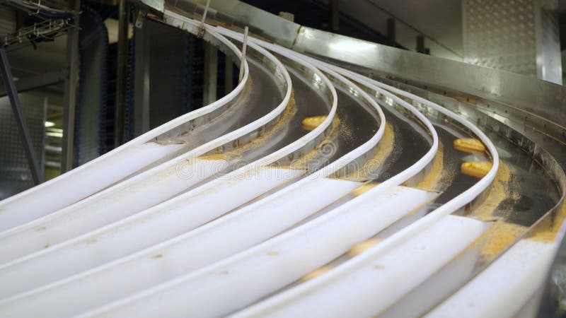 Breads Moving on Industrial Conveyor Belt in Bakery Stock Image - Image ...