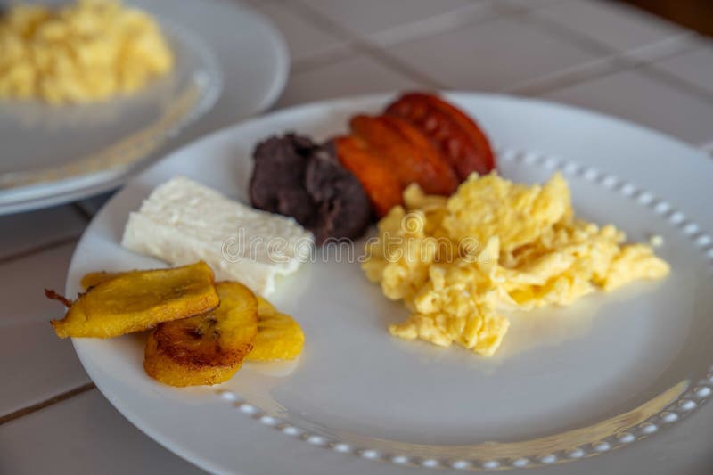 Close Up of Breakfast Platter with Plantains, Eggs, Chorizo, Cheese ...