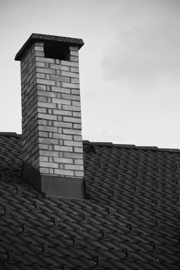 Close Up on Two Brick Chimney on Rooftop Isolated in Sky Stock Photo ...