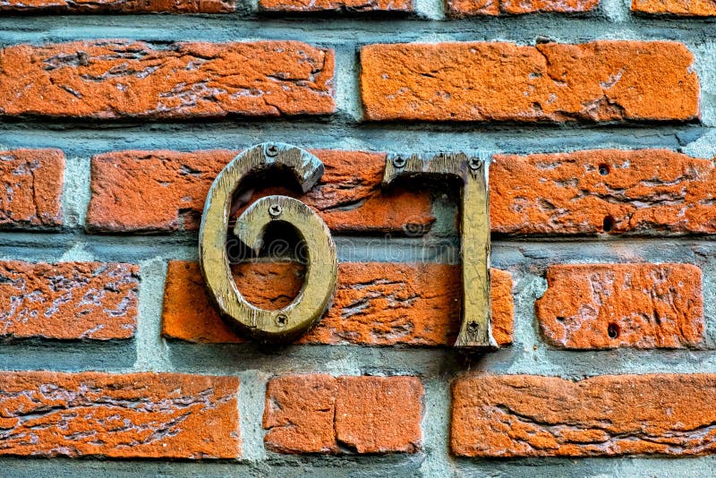 Close-up of the Brick Wall with the Number 67 on it Stock Photo - Image ...