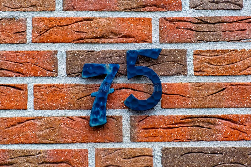 Close-up of the Brick Wall with the Number 75 on it Stock Photo - Image ...