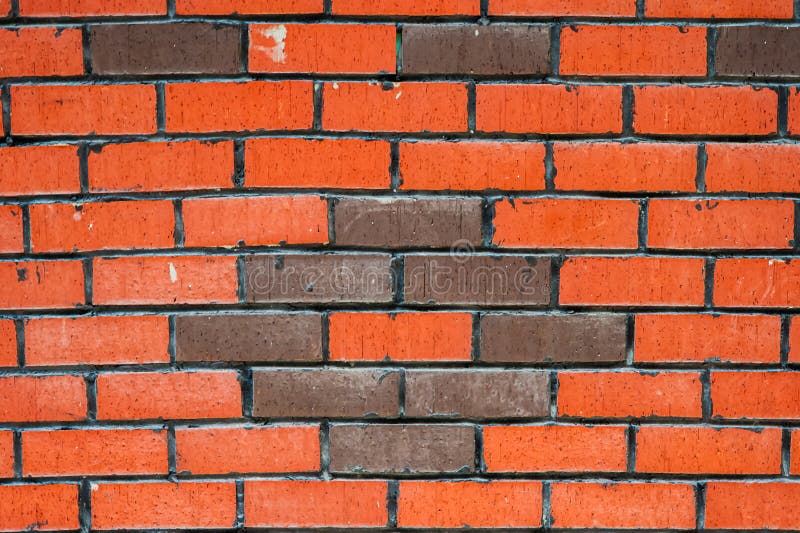 Close Up of a Brick Wall with a Unique Pattern of Orange and Brown ...